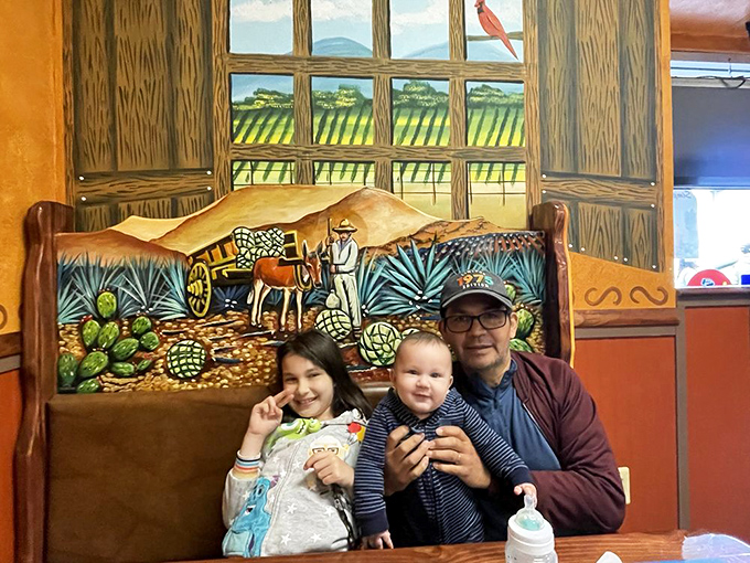 The vibrant murals aren't just decoration &ndash; they're portals to Mexico. Families gather for authentic meals against backdrops that enhance the cultural experience.