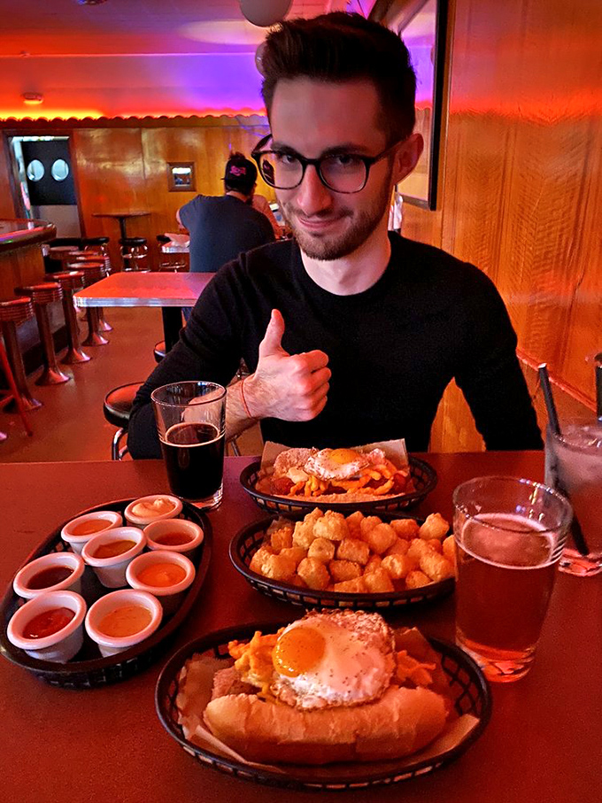 The thumbs-up says it all&mdash;hot dog nirvana achieved! Multiple baskets of joy with various toppings prove that variety truly is the spice of life.