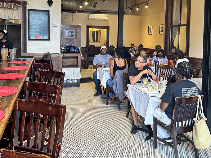 The dining room hums with the universal language of good food. Strangers become friends when united by the pursuit of perfect fried chicken.