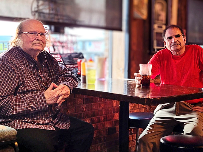 Where strangers become friends over shared BBQ appreciation. These gentlemen know the secret: great conversations happen when excellent food is the mediator.