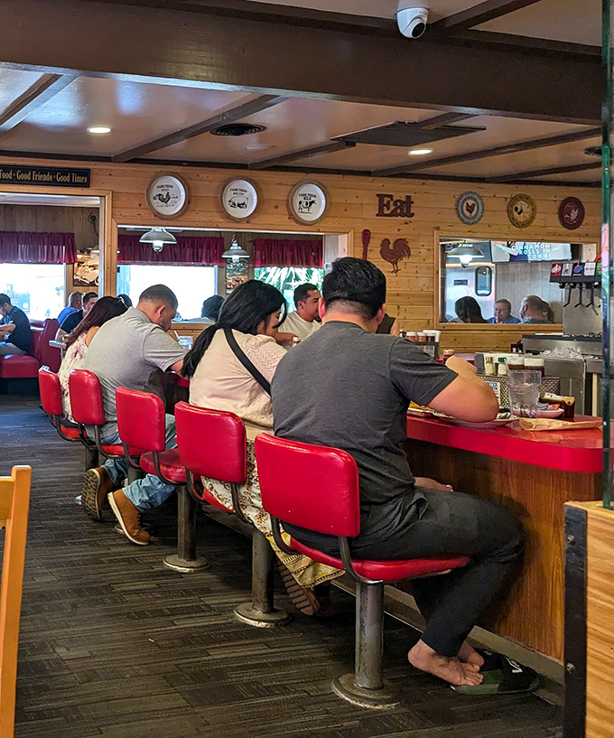 The counter seating&mdash;where strangers become friends and diet plans go to die. Worth every calorie-laden minute.