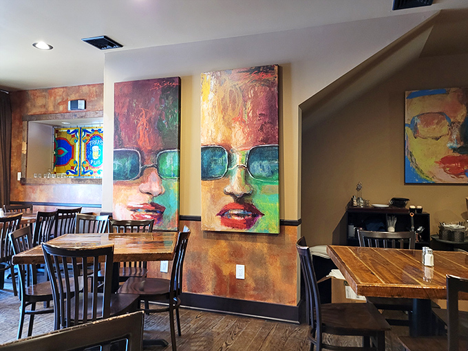 Art meets appetite in this dining space where conversations flow as easily as the drinks. Those paintings have seen some stories.