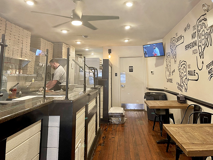 The minimalist dining area keeps your focus where it belongs&mdash;on the food. Wood tables, simple chairs, and the anticipation of greatness.