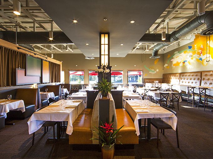 The dining room strikes that perfect balance between "special occasion" and "Tuesday night escape." White tablecloths that don't judge your jeans.