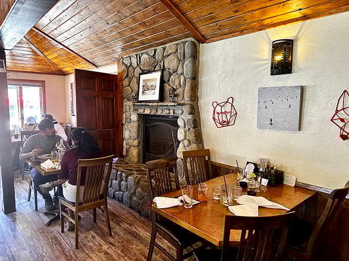 That stone fireplace isn't just for show&mdash;it's the heart of a dining room where memories are made between bites of exceptional food.