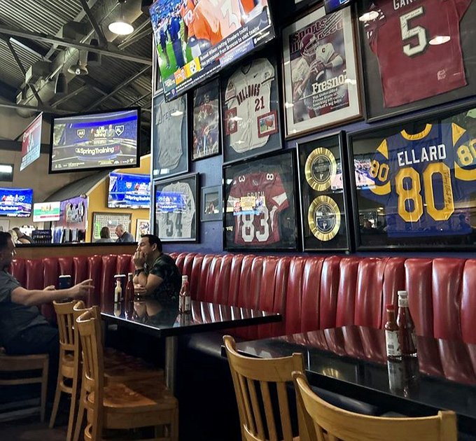 Sports jerseys stand guard over red booths where countless BBQ dreams have come true.