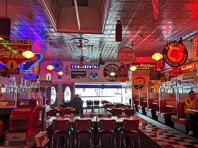 Red vinyl booths under the glow of vintage signs create the perfect backdrop for food that tastes like childhood memories, only better.