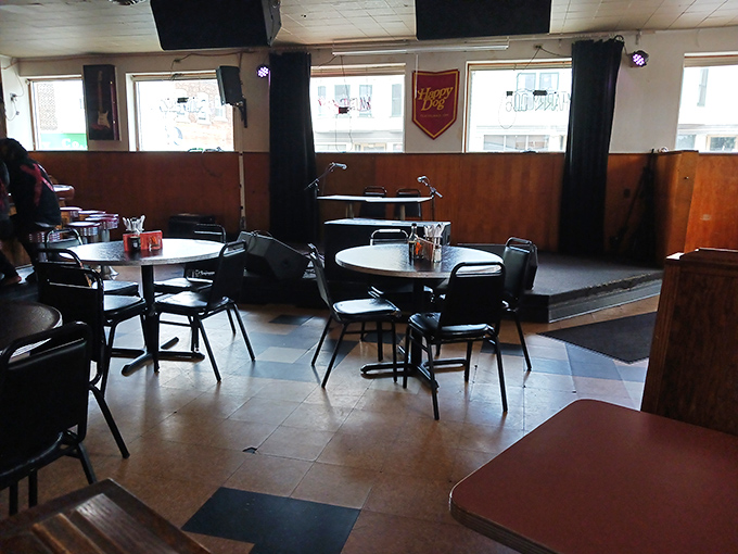 Tables and chairs tell stories of countless hot dog epiphanies in this delightfully democratic dining space.