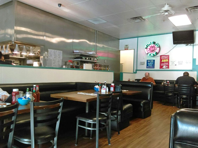 Classic diner aesthetics with those teal accents &ndash; where conversations flow as freely as the coffee refills.