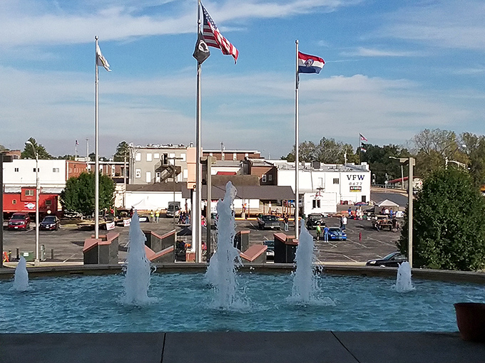 The downtown fountain plaza creates a gathering spot where flags fly, water dances, and conversations happen at a pace that doesn't require shouting.