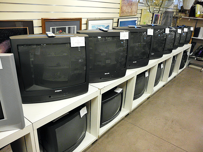 The well-organized clothing department transforms bargain hunting into a sport, with numbered aisles guiding shoppers through the fashion time machine.