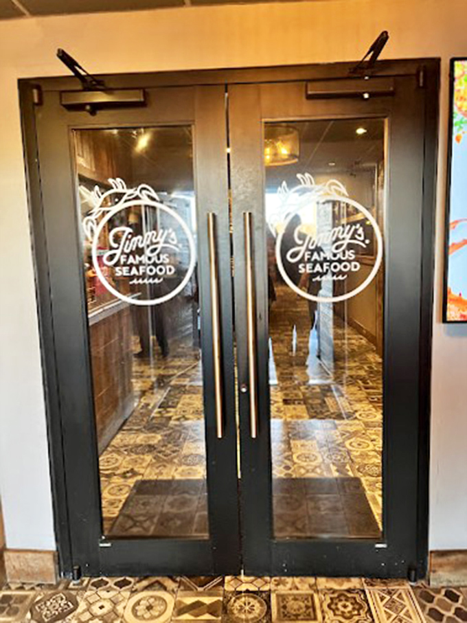 These doors don't just open—they transport you to seafood nirvana. The elegant logo promises what awaits inside.