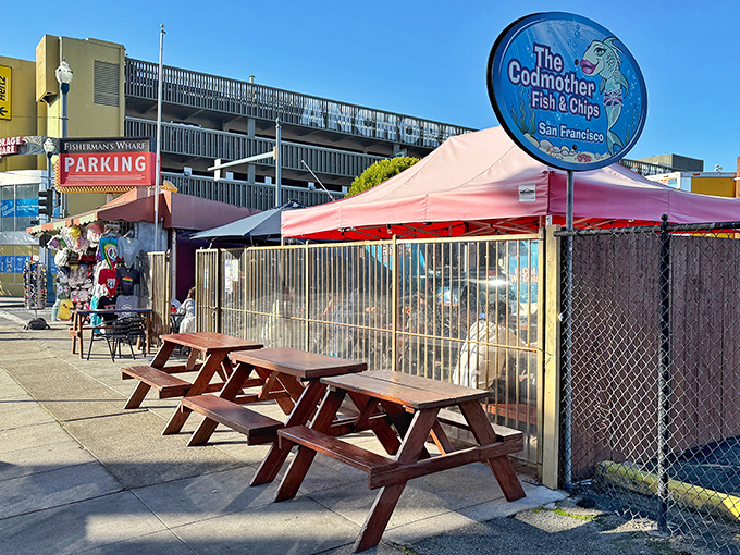 The Codmother's outdoor setup feels like a secret clubhouse for food lovers&mdash;wooden picnic tables, simple fencing, and the promise of seafood that doesn't need fancy surroundings.