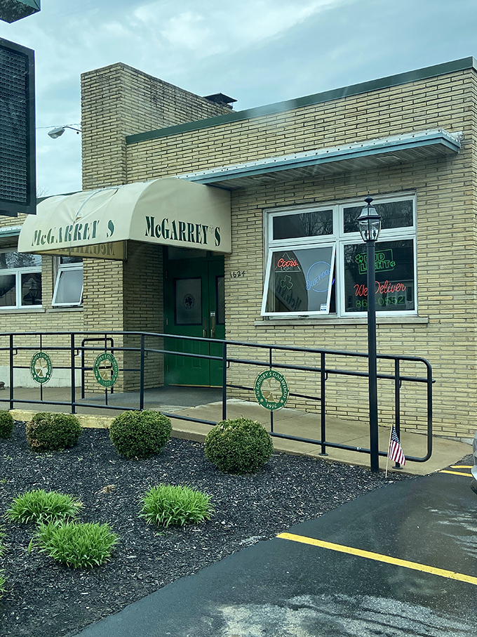 The accessibility ramp and tidy landscaping say "everyone welcome"—the sign promises family dining while the building whispers "local institution."