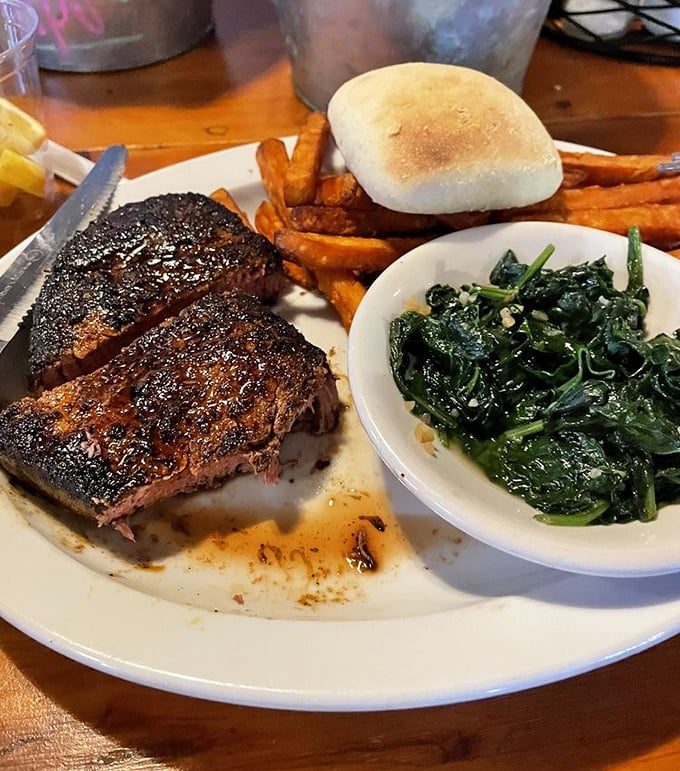 A perfectly seared filet, sweet potato fries, and garlicky spinach. This plate doesn't need filters or hashtags&mdash;just your undivided appreciation.