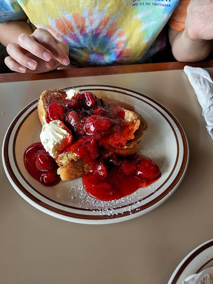 French toast that turned its back on France and embraced America with strawberry topping and enough butter to make Julia Child smile.
