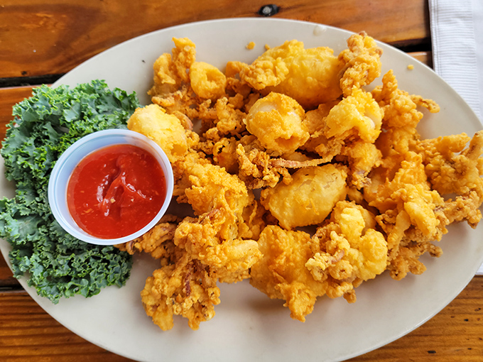 Golden-fried shrimp that crunch like autumn leaves but hide interiors as tender as a country love song. The cocktail sauce adds just enough kick.