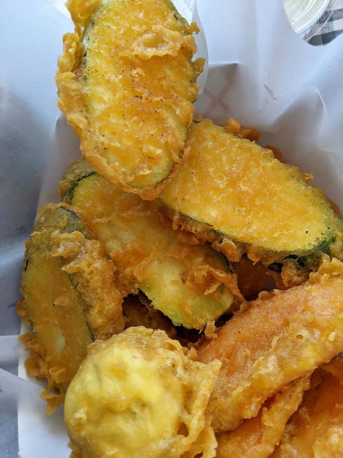 These golden-battered zucchini slices transform a humble vegetable into something your vegetable-averse nephew might actually fight you for.