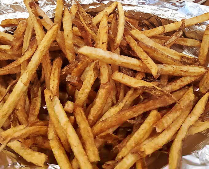 Fresh-cut fries that achieve the golden trifecta: crispy exterior, fluffy interior, and just enough salt to make you reach for your drink between bites.