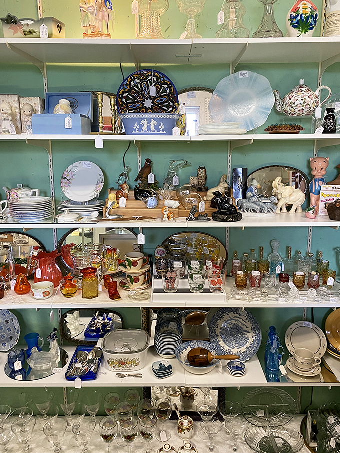 Shelves of glassware and ceramics arranged by color tell the story of American dining tables through the decades &ndash; from Depression glass to mid-century modern.