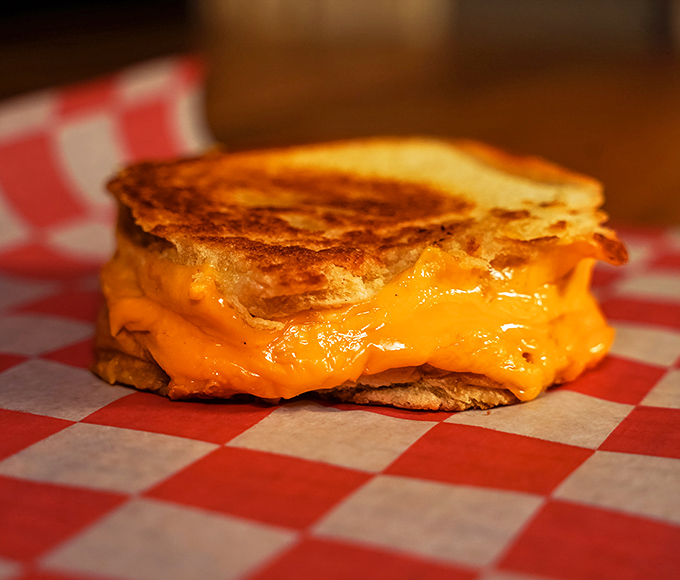 The humble grilled cheese, elevated to art form status with perfectly golden bread and that cheese pull that dreams are made of.