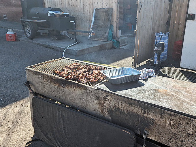 Where the magic happens! This well-seasoned pit has probably seen more meat than a butcher's convention, its surface telling stories of countless perfect smokes.