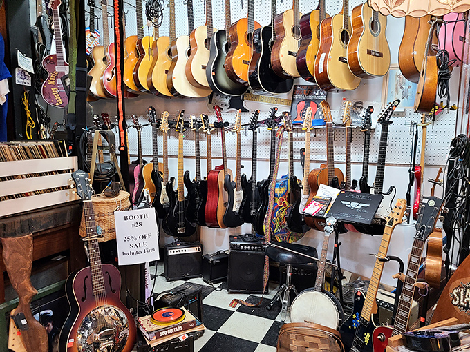 A classic guitar waits patiently for musical resurrection, its strings silent but its potential still singing.