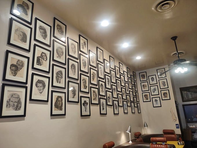 The wall of Hollywood portraits watches over diners like a black-and-white guardian council of entertainment royalty.