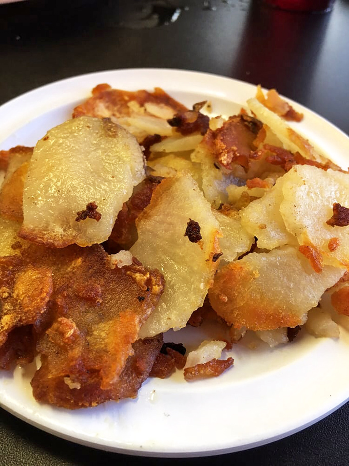 Home fries that understand the assignment &ndash; crispy outside, fluffy inside, seasoned like someone actually cares.