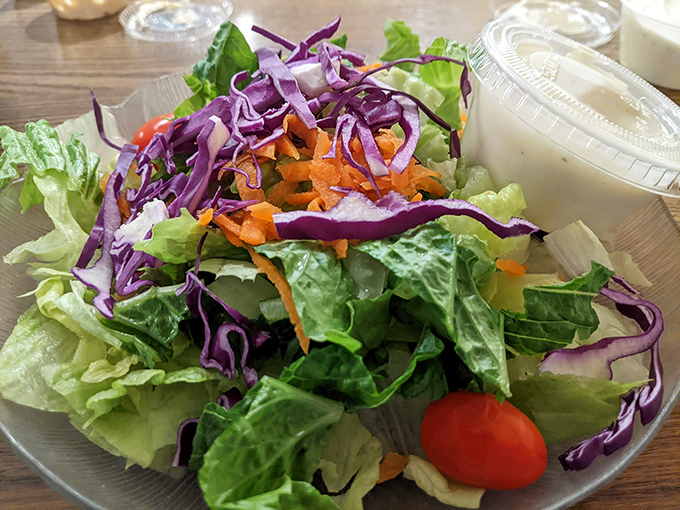 A house salad that actually deserves attention &ndash; crisp, colorful, and fresh enough to momentarily distract you from the seafood main event.