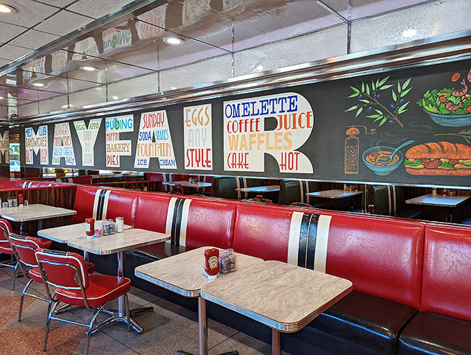 Classic diner seating where strangers become friends over pie. The green booths have heard more Philadelphia stories than a Liberty Bell tour guide.