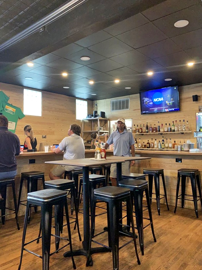 Modern rustic charm meets burger joint functionality. The bar area offers front-row seats to cold drinks and sports on the screen.