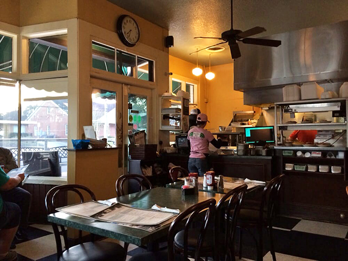 The open kitchen design isn't just practical—it's dinner theater where the stars are your breakfast and the soundtrack is sizzling griddles.