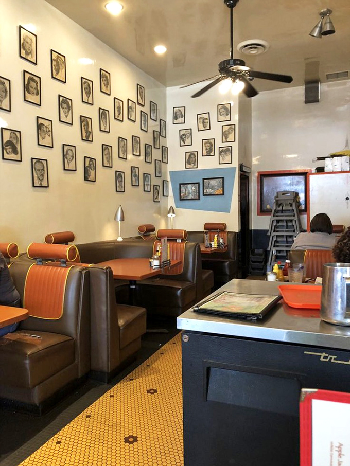 The wall of framed portraits watches over diners like a jury of culinary ancestors, approving each bite in this retro-cool space.