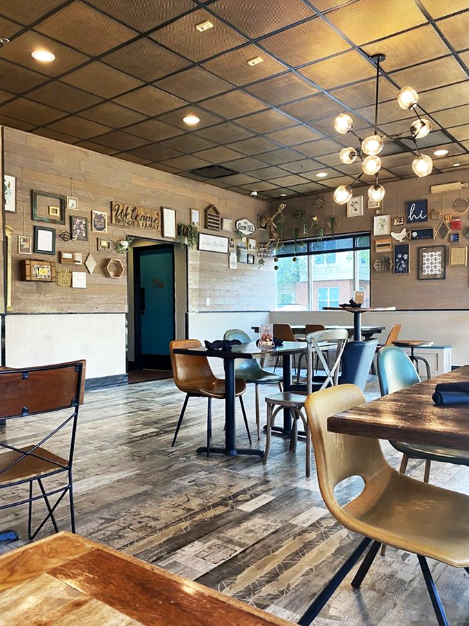 The gallery wall says "we're casual" but those light fixtures whisper "we're serious about ambiance." This is where comfort meets style for a long brunch date.