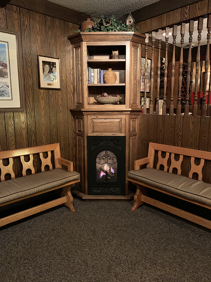 The waiting area where anticipation builds like the opening notes of your favorite song. That fireplace knows the stories of countless celebration dinners.
