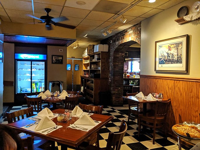 Exposed brick archways and carefully set tables create dining nooks that feel both intimate and part of something larger&mdash;the perfect setting for memorable meals.