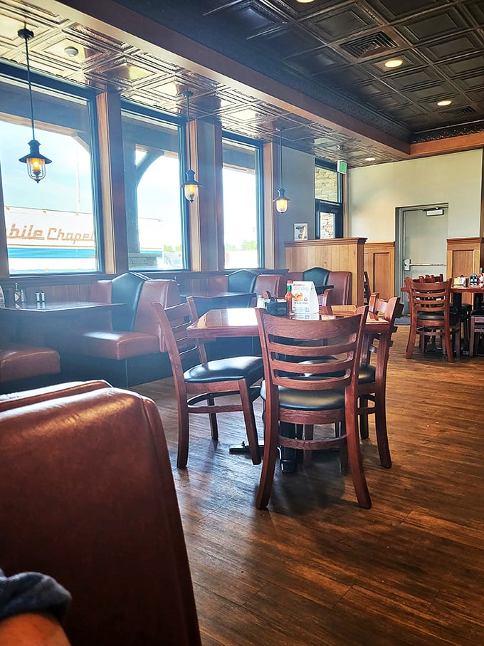Booths bathed in natural light where breakfast conversations flow as smoothly as the bottomless coffee refills.