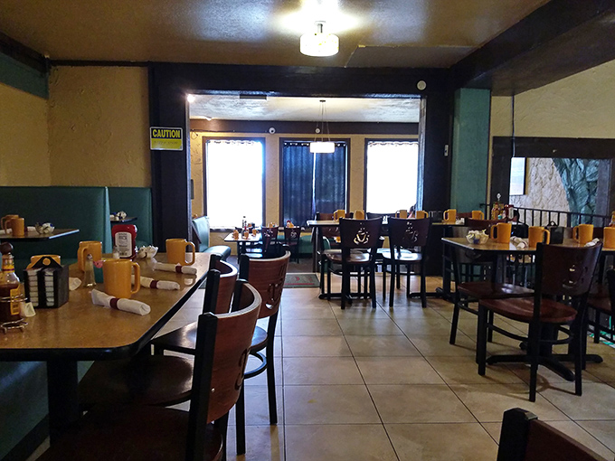 The dining room's warm wood tones and tile floors create that "everybody knows your name" vibe—even when nobody actually does.