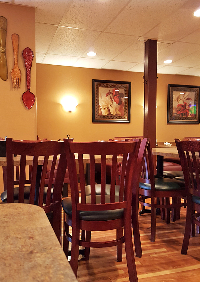 Those oversized wooden forks and spoons on the wall aren't just decoration&mdash;they're a warning about the portion sizes you're about to encounter.