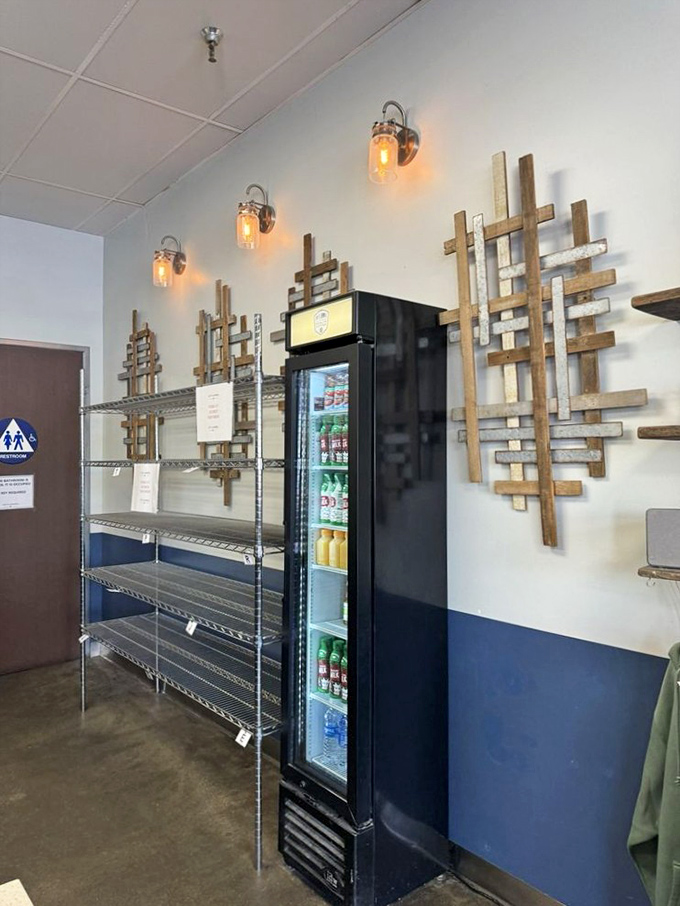 Industrial-chic meets comfort with those Mason jar lights and wooden wall art. Even the refrigerator looks like it belongs in a design magazine.