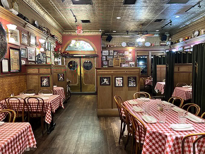 Red walls adorned with history, wooden booths polished by generations of elbows. This dining room feels more like a maritime museum where you can eat the exhibits.