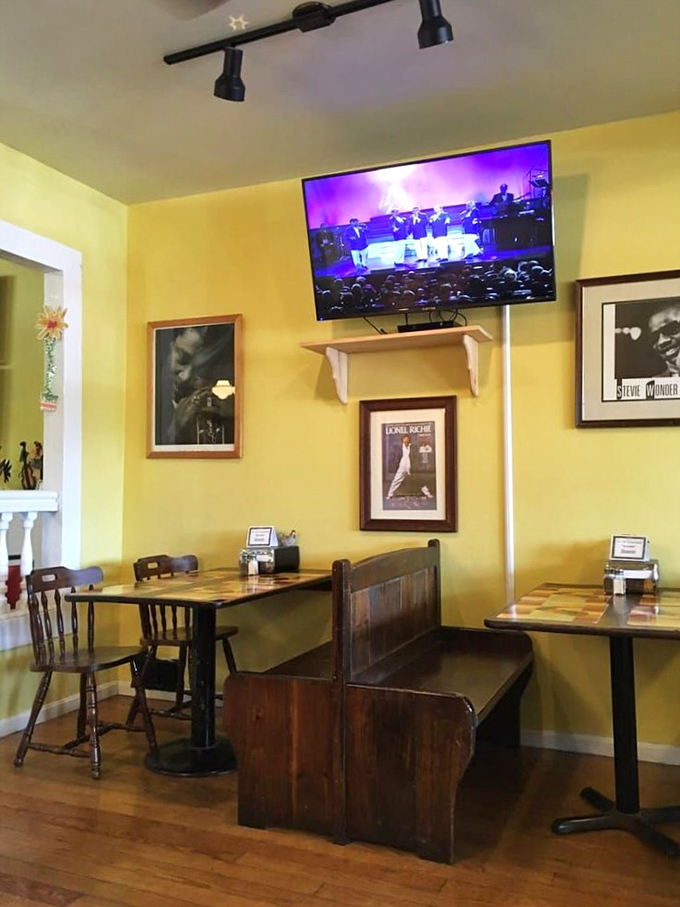 Yellow walls adorned with music legends create a dining room that feels like you've been invited to a family gathering where soul food meets soul music.