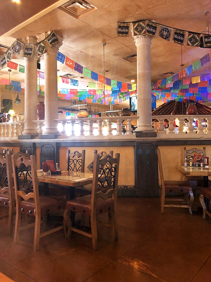 The dining room feels like you've been invited to a stylish Mexican family's home. Those colorful banners are practically winking at you. 