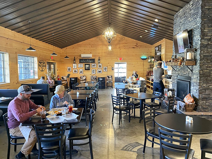 The dining room exudes rustic elegance with its vaulted wooden ceiling and stone fireplace. A gathering place where locals and travelers alike break bread.