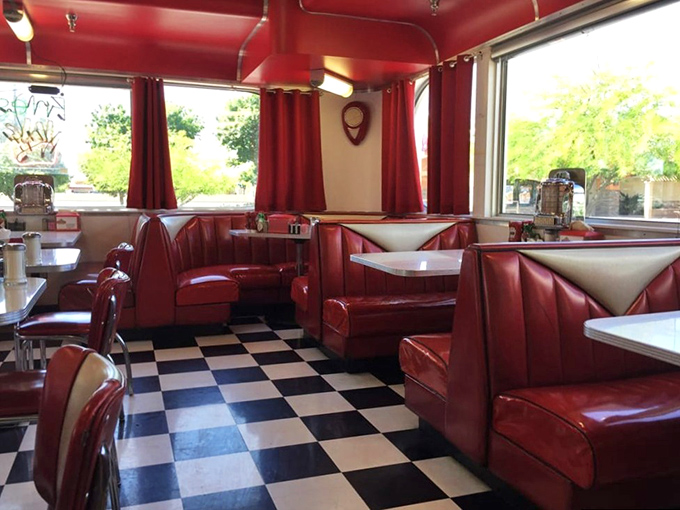 The dining room buzzes with conversation, clinking silverware, and the sweet sound of milkshake blenders working. 