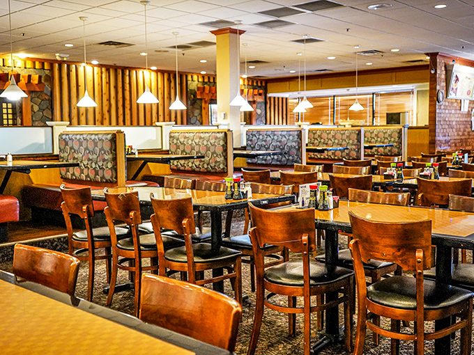 Warm wood tones and thoughtful lighting create an atmosphere that says, "Stay awhile, have another plate. We're not judging."