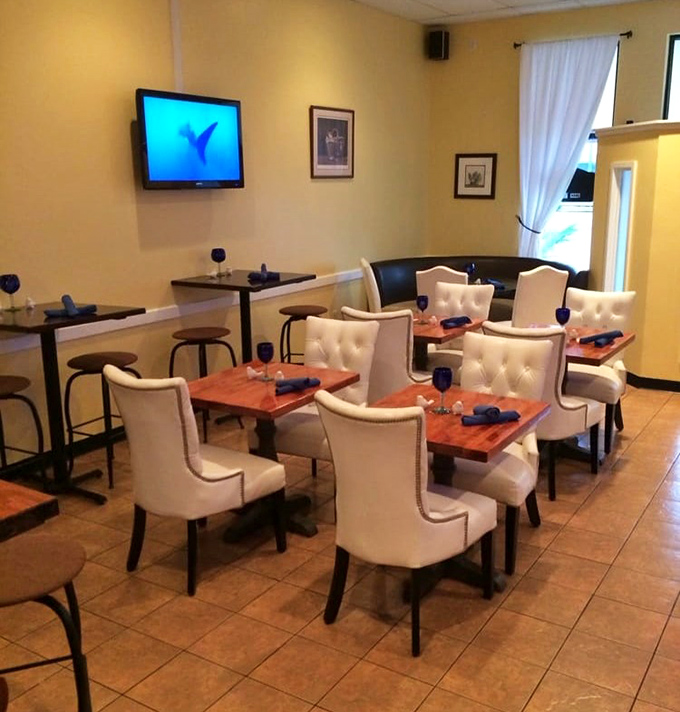 White chairs that don't scream "seafood joint" but whisper "we take our dining atmosphere as seriously as our fish." Elegant without pretension.