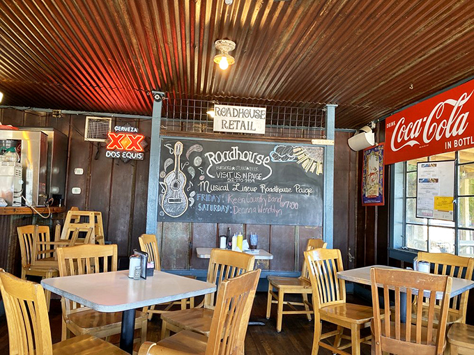That corrugated metal ceiling and chalkboard menu wall create the perfect backdrop for conversations that inevitably turn to "remember when places like this were everywhere?"