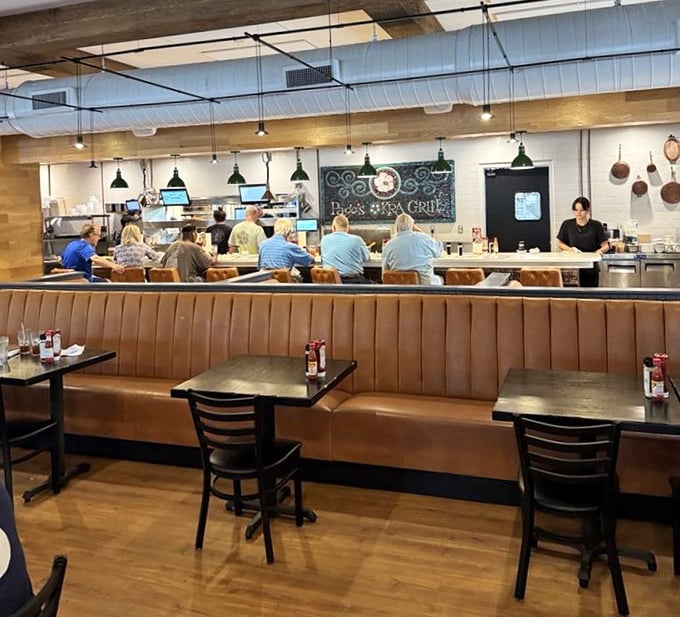 The open kitchen design lets you watch culinary magic happen in real time. Like dinner and a show, but the food is the real star.